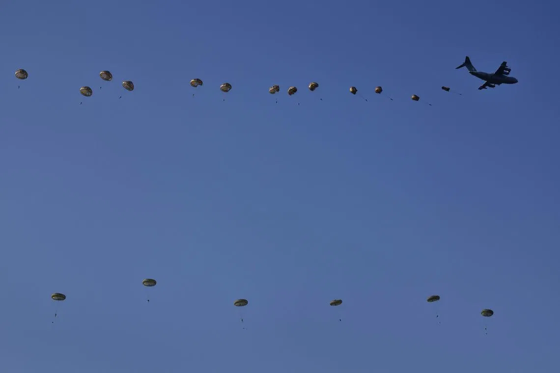 Hundreds of parachutists jump to mark WWII operation | The Straits Times