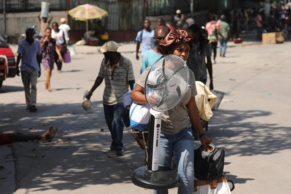 Haiti PM's return still murky as gang conflict worsens | The Straits Times