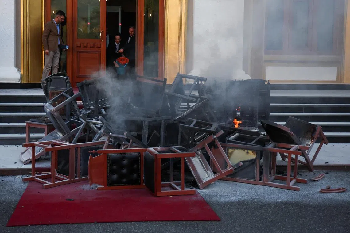 Albanian opposition protests jailing by setting chairs on fire outside ...