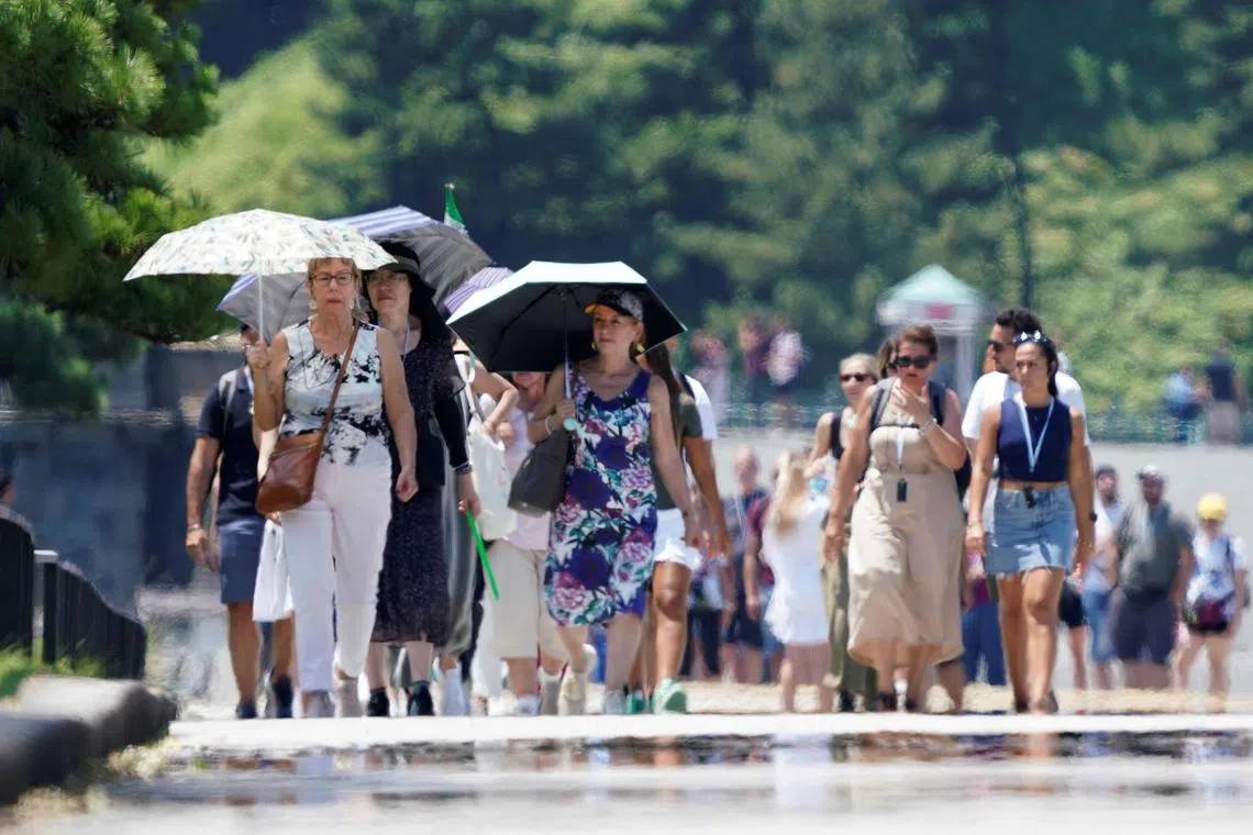Japan issues heatstroke alerts as temperatures soar; torrential rain ...