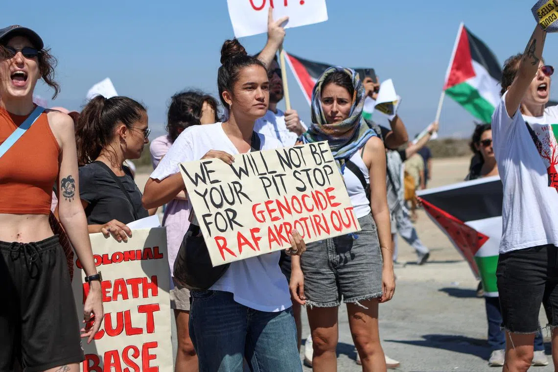 Activists protest escalating Mideast crisis outside UK base in Cyprus ...