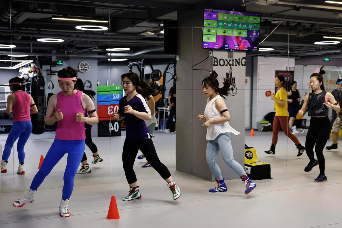 Punching and pumping iron, Chinese women go ‘Yolo’ | The Straits Times