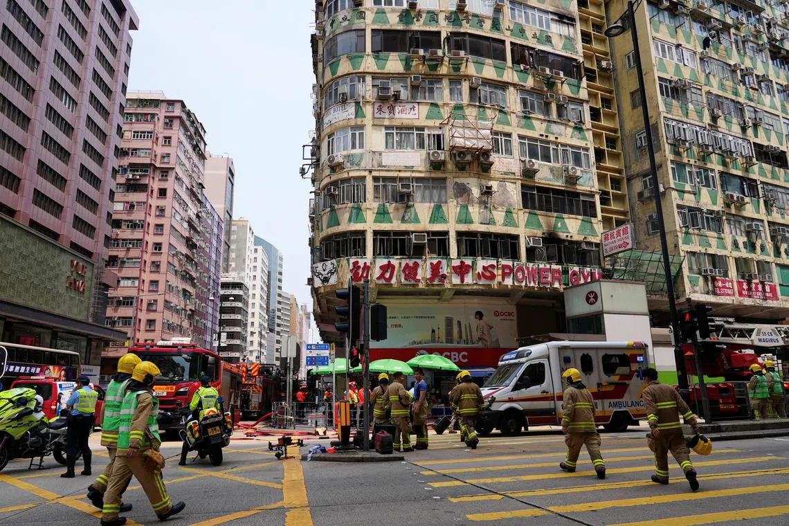 Fire in packed Hong Kong building kills 5, with dozens in hospital, 300 ...