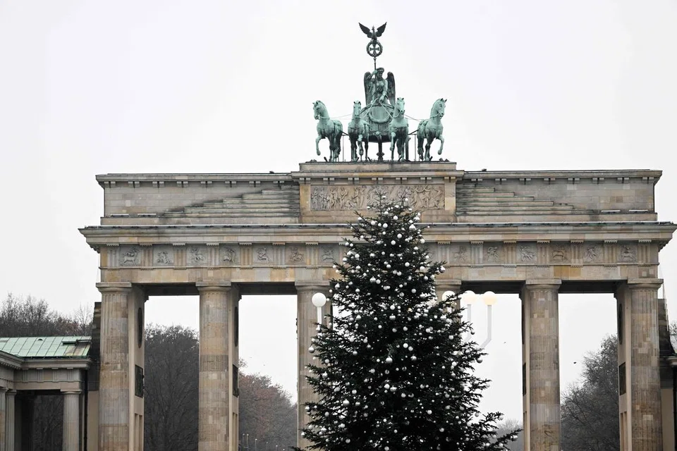 German climate activists cut top off Christmas tree | The Straits Times