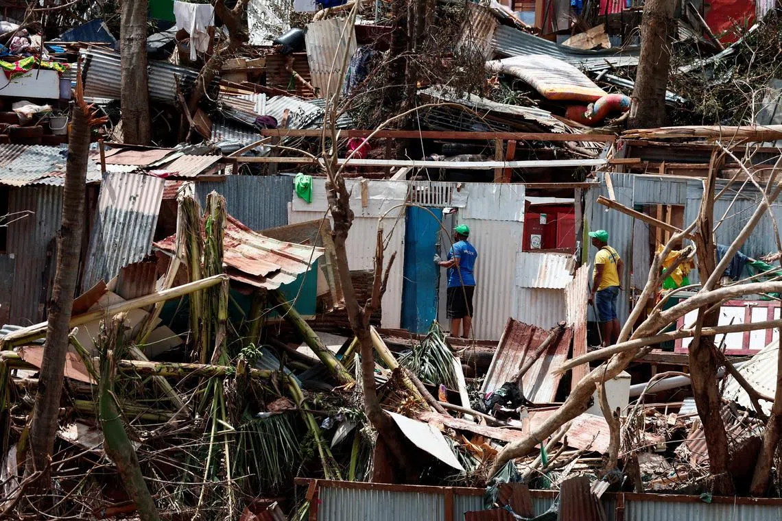People in France's Mayotte pick up pieces of their lives after cyclone ...