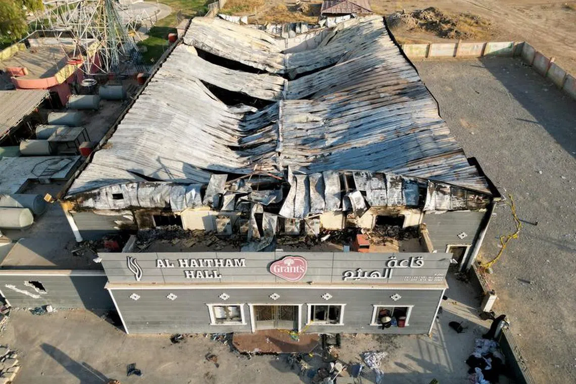 Mourners demand accountability, bury loved ones after Iraq wedding ...