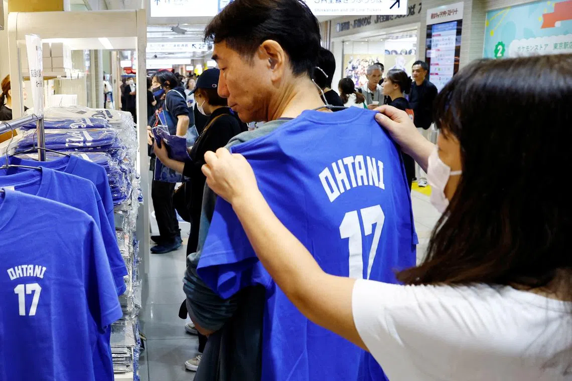 Fans in Japan line up for Ohtani merchandise ahead of World Series ...