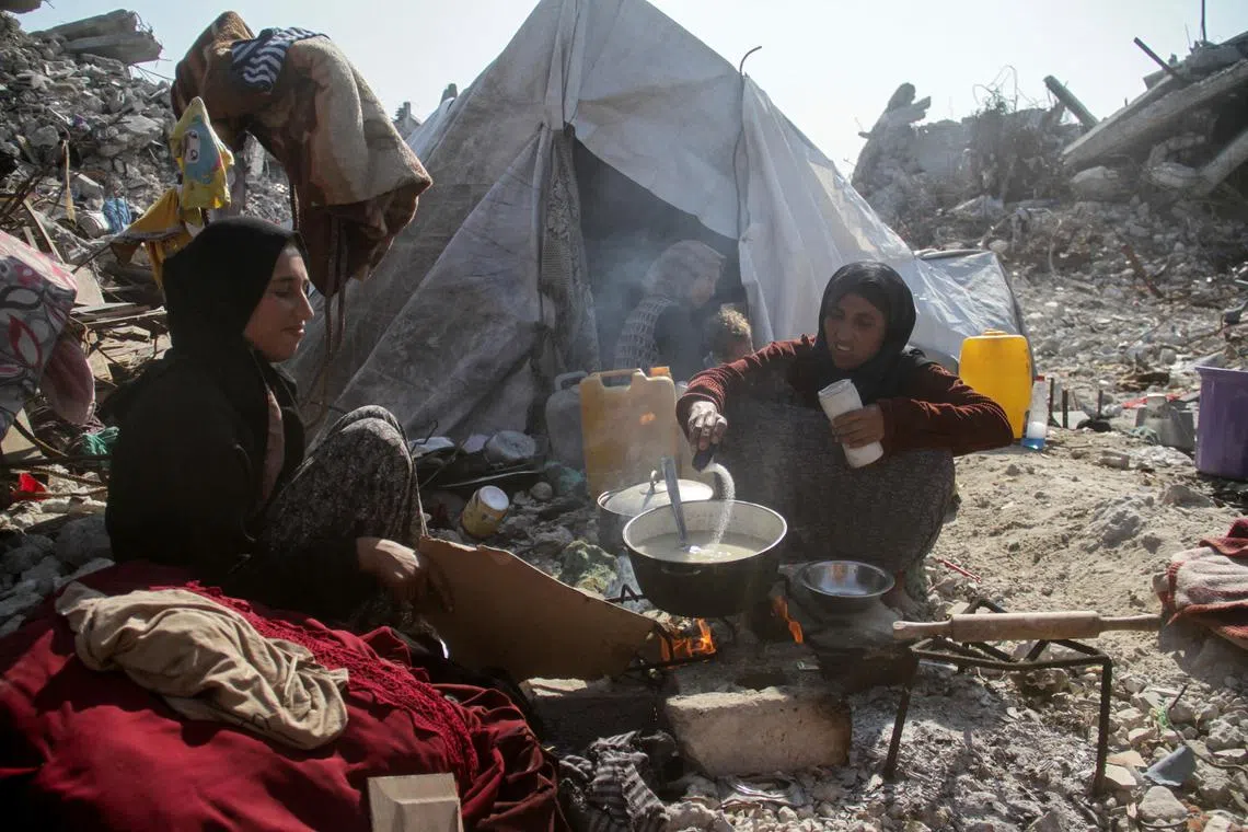 Rats, dogs and torn clothes amid the ruins of Gaza homes | The Straits ...