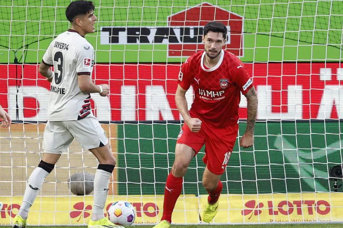 Leaders Leverkusen battle past Heidenheim 2-1 for record-equalling run ...