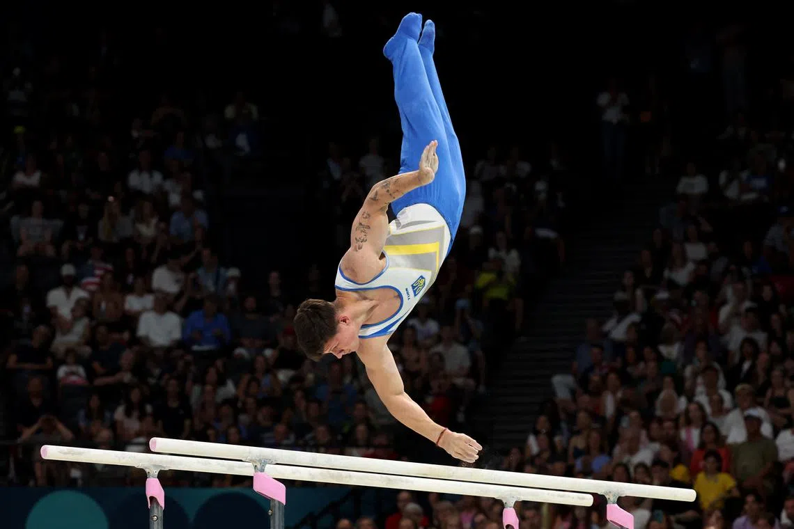 Gymnastics-China's Zou, 'king of parallel bars', retains title | The ...