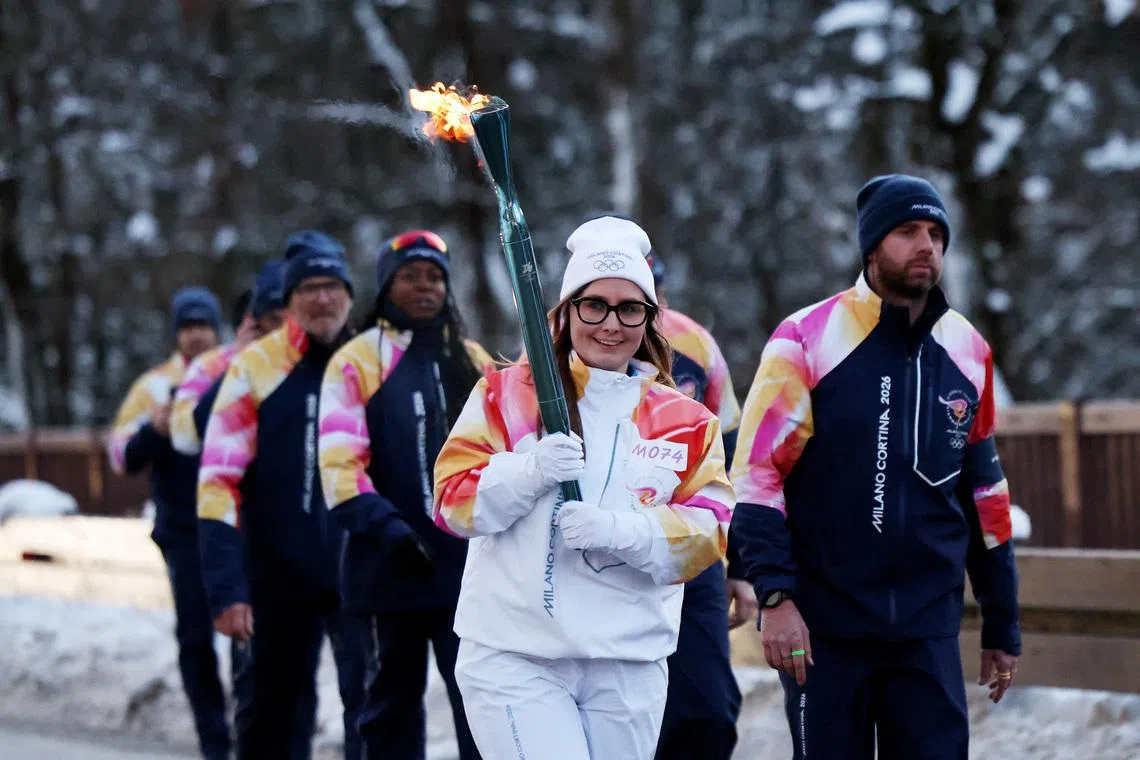 Torch arrives in co-host Cortina on anniversary of 1956 Games | The ...