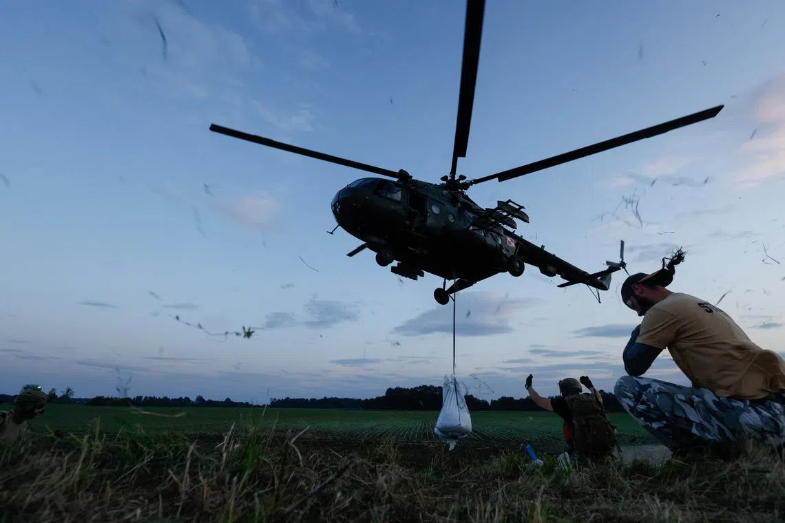 Polish army helicopters join flood defence effort | The Straits Times
