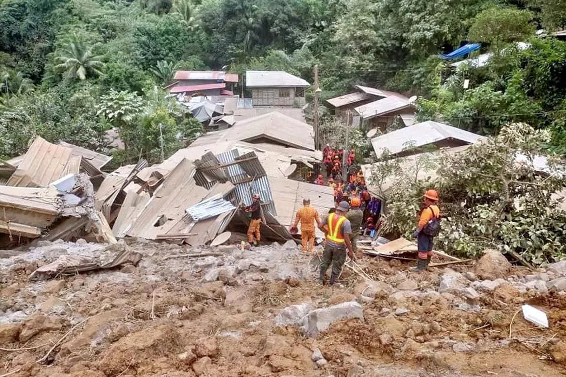 Rescuers use bare hands to search for Philippine landslide survivors | The Straits Times
