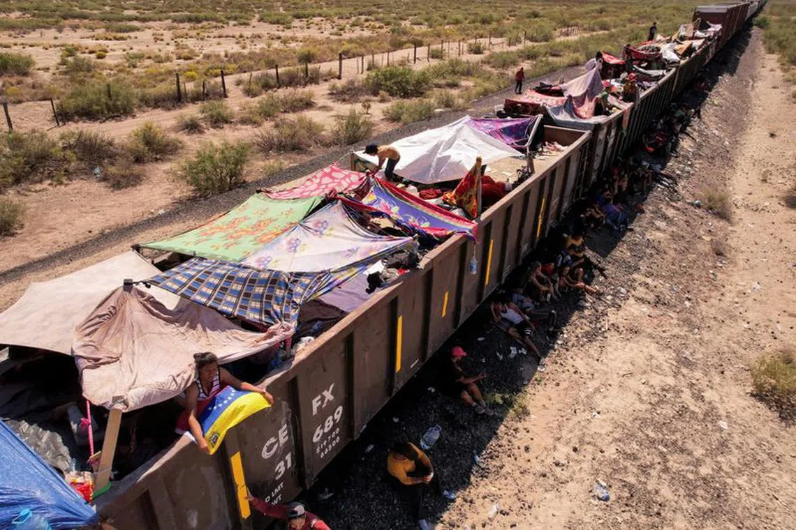 Migrants aboard Mexico cargo trains stranded miles from U.S. border ...