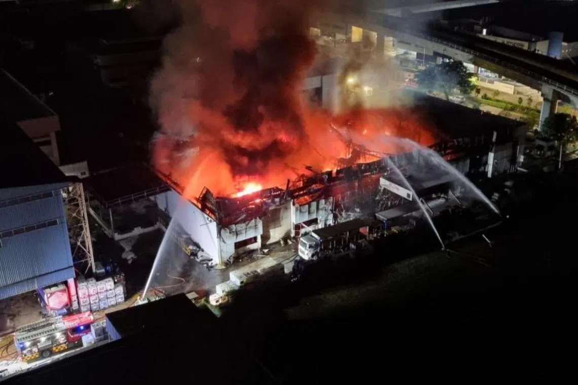 Huge fire in Tuas industrial building causes $10m in losses; MRT ...