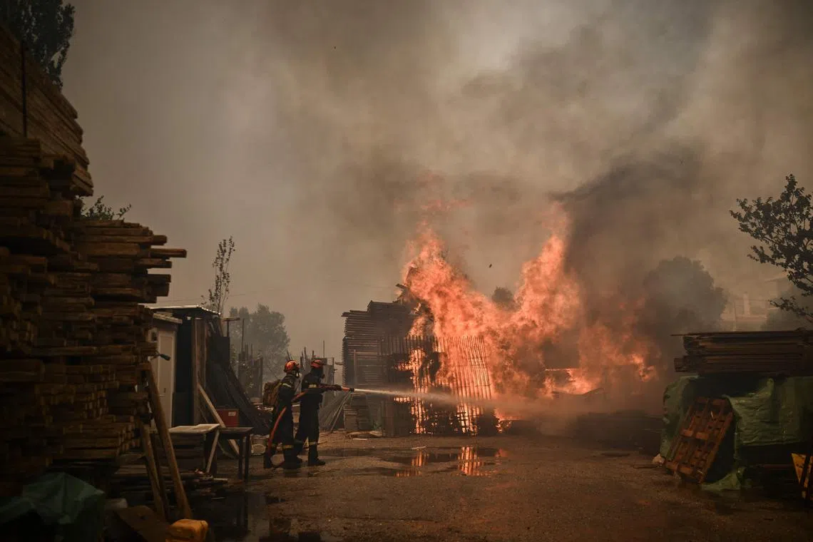 Rescuers find 18 burned bodies as wildfires spread in Greece | The ...