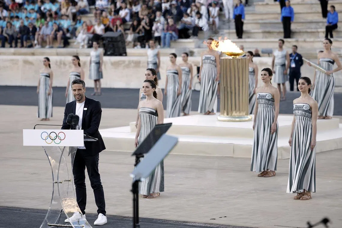 Paris organisers receive flame in Athens ahead of relay | The Straits Times