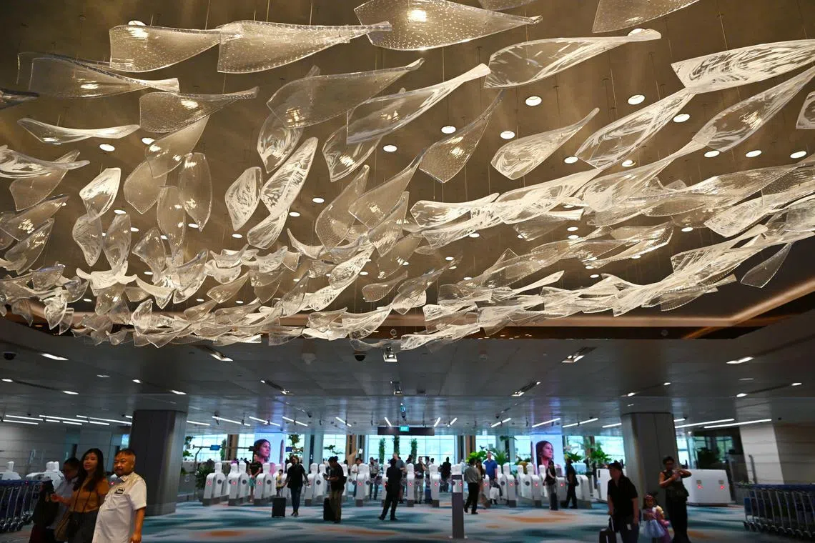 Changi Airport T2 reopens fully with 4-storey waterfall display, new ...