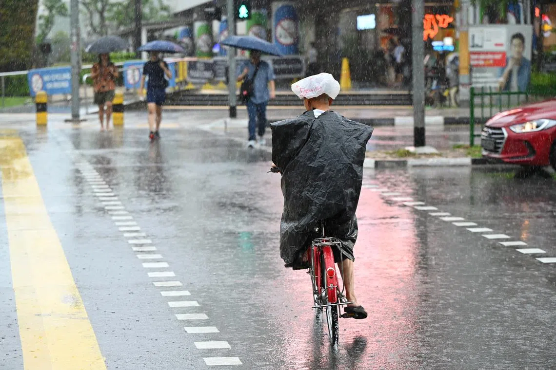 Heavy rain prompts flood warnings for many areas of Singapore, delays ...