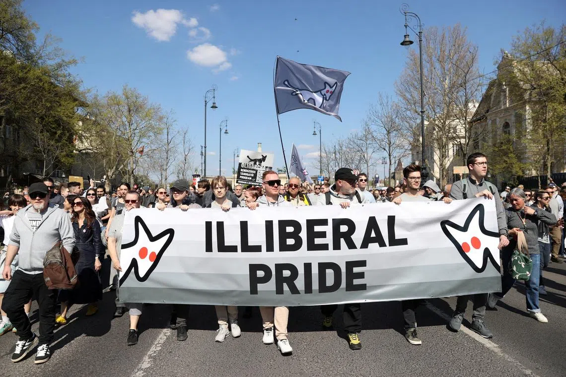 Protesting Hungarians mock Orban's anti-LGBT moves, saying 'Let's all ...
