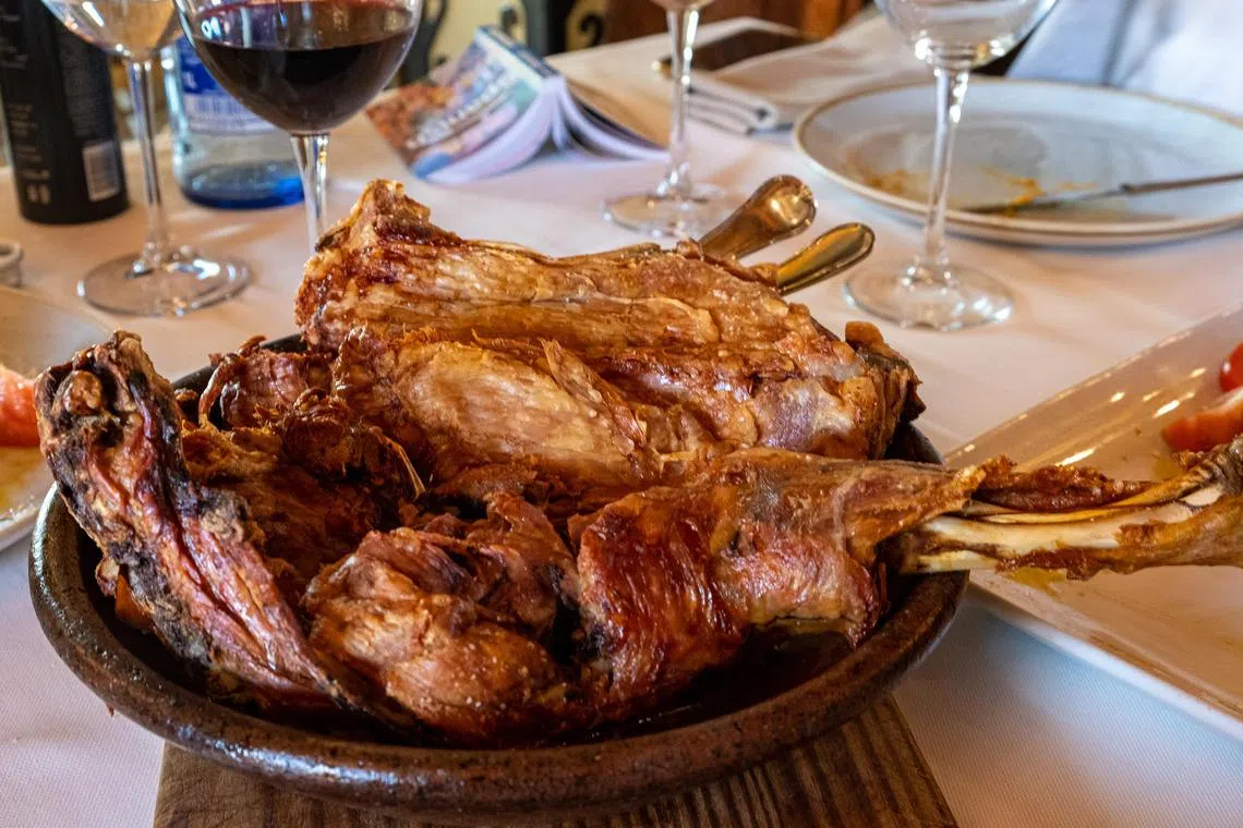 In Quest Of: Tender roast pig cut with a plate and foodie pleasures ...