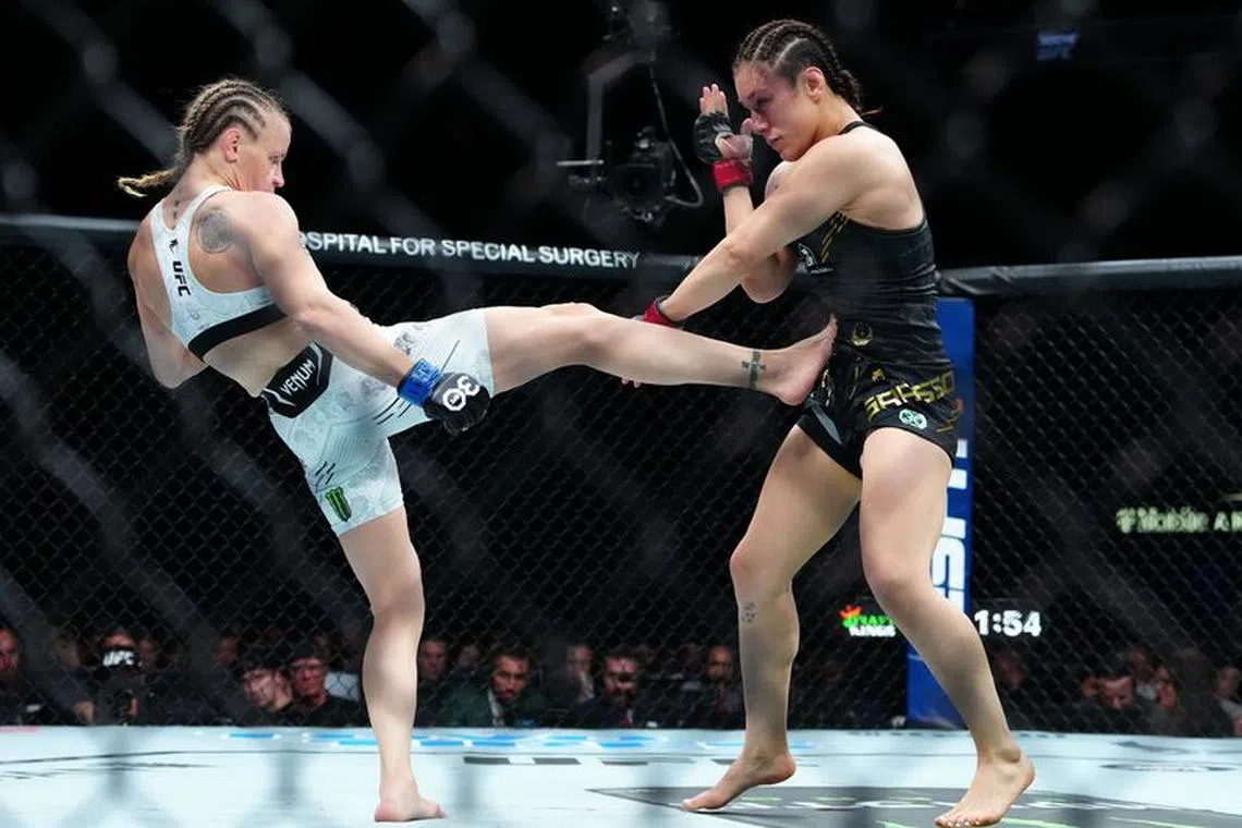 Mixed Martial Arts-Grasso retains UFC flyweight title in rare split ...