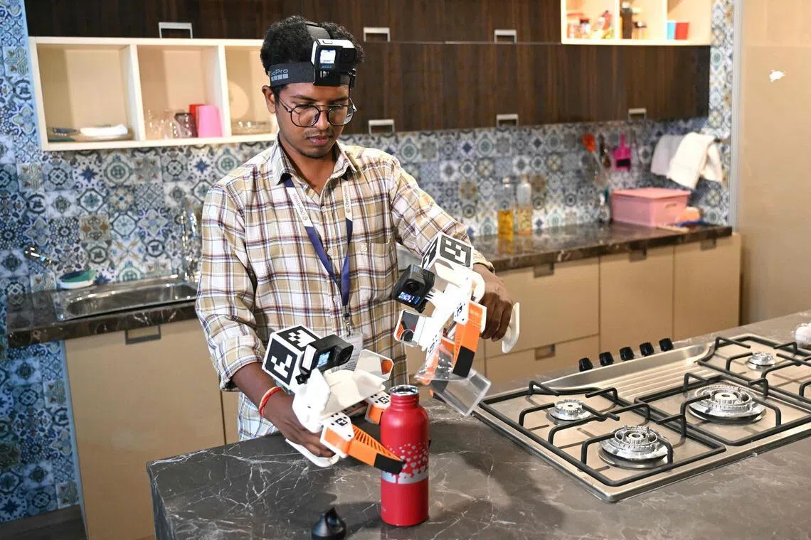 The Indian workers training AI robots to take their jobs | The Straits ...