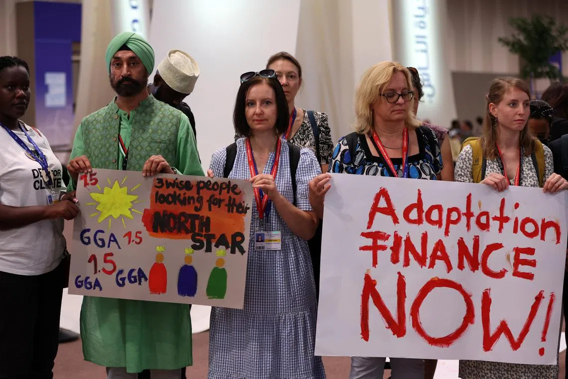 COP28 calls for adapting to warmer world without resolving how to pay ...