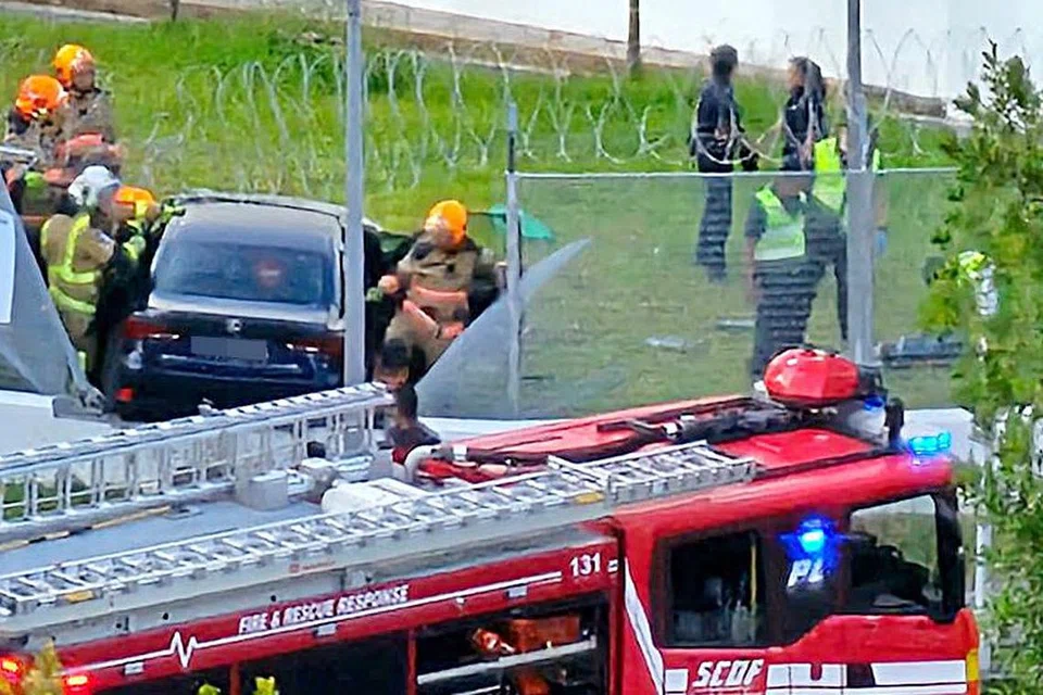 Elderly woman crashes car through fence at Clementi Police Division HQ ...