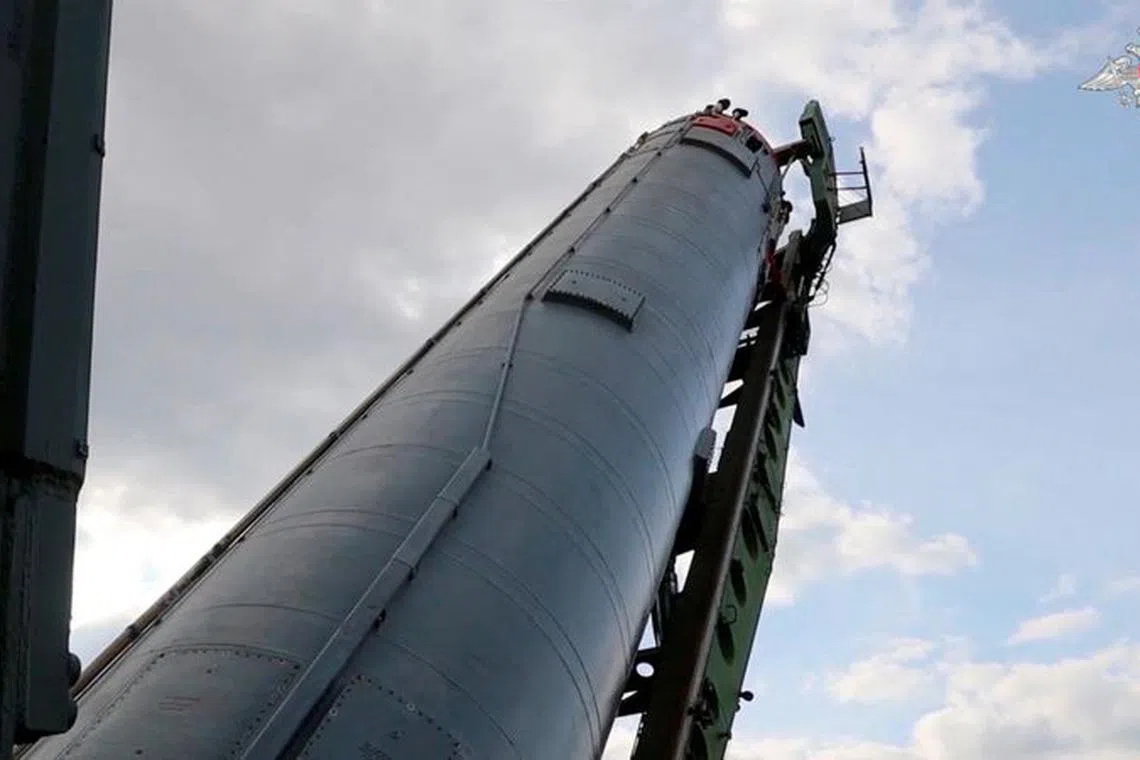 Russia loads missile with nuclear-capable glide vehicle into launch ...