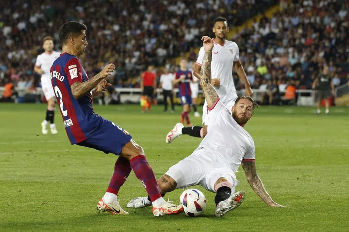 Ramos own goal gifts Barca win over Sevilla | The Straits Times