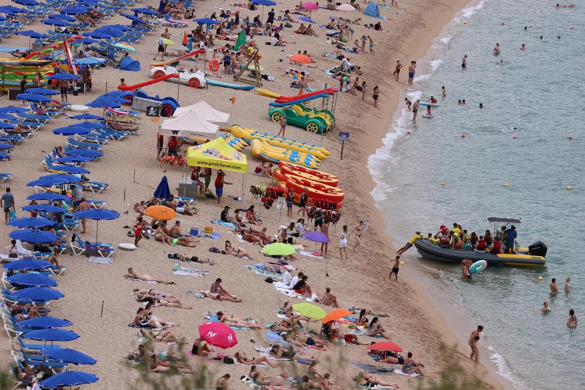 Spaniards struggle to enjoy their own beaches in tourist deluge | The ...