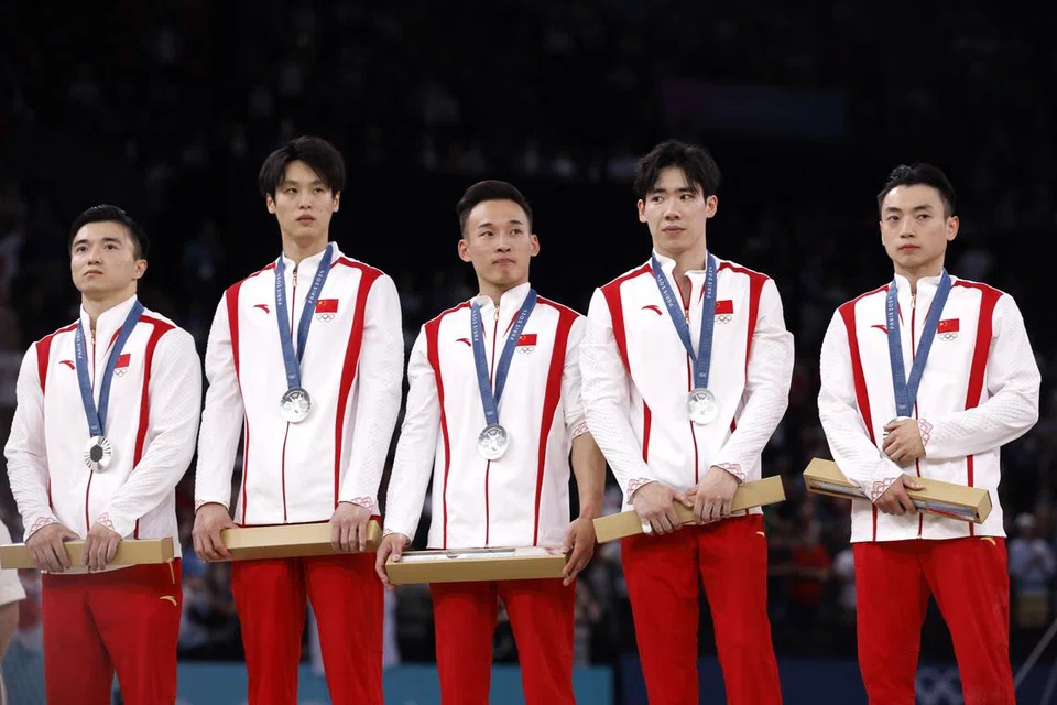 Gymnastics-Chinese gymnasts devastated after letting team gold slip ...
