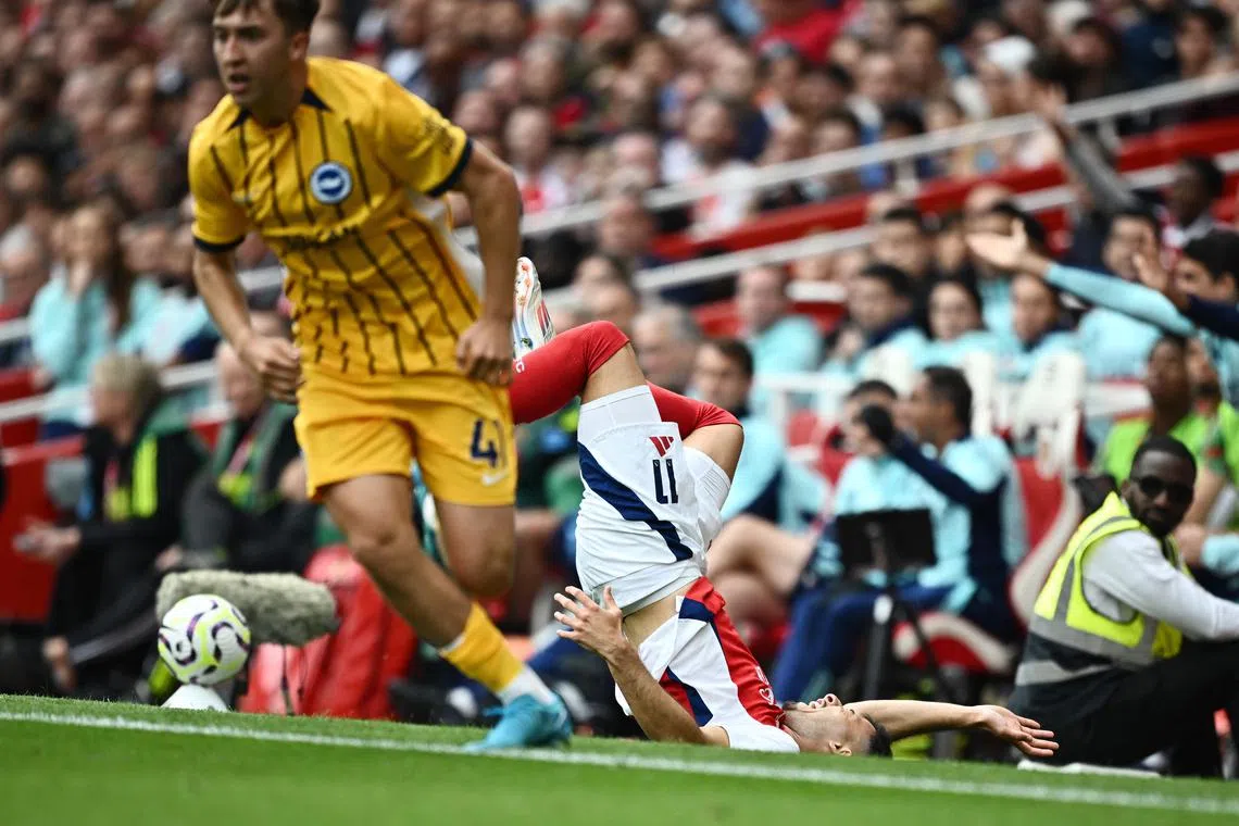 Brighton end 10-man Arsenal's winning start with 1-1 draw | The Straits ...