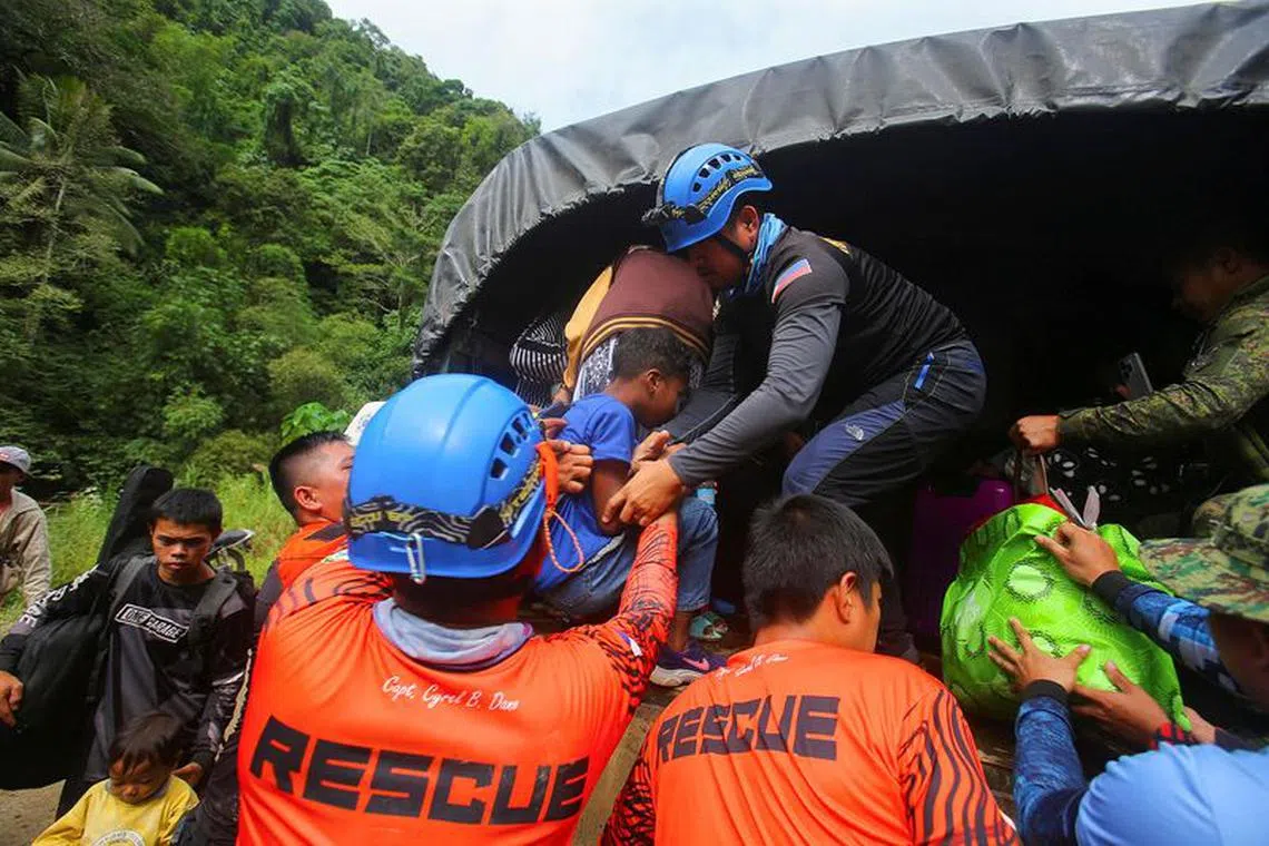 Rescued child raises hope of finding more survivors in Philippine ...