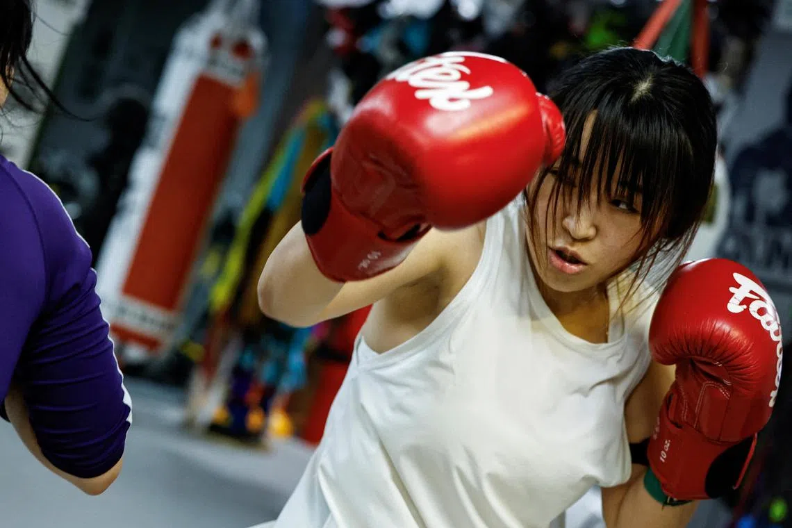 Punching and pumping iron, Chinese women go ‘Yolo’ | The Straits Times