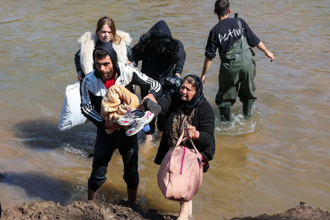 Syrians flee sectarian killing into Lebanon | The Straits Times