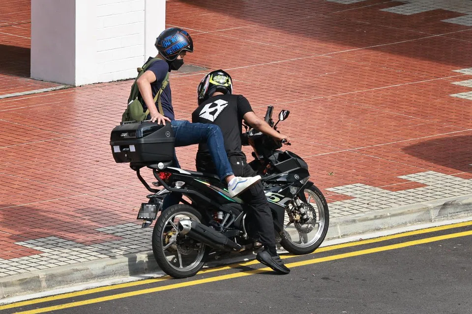 Food delivery riders offering illegal hitch rides on messaging platforms | The Straits Times