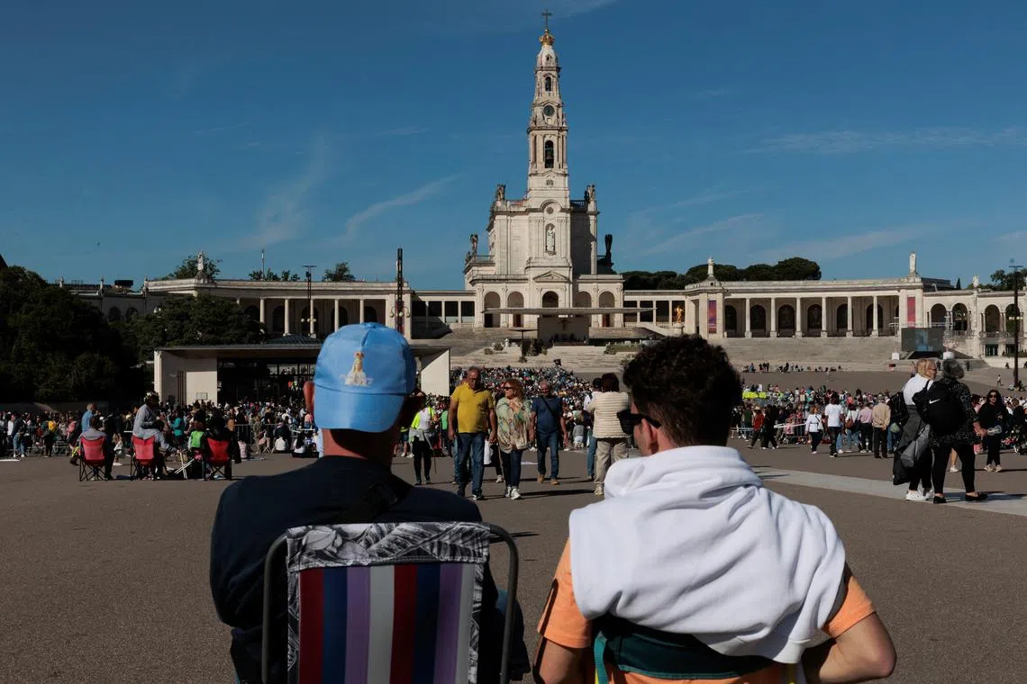 Faithful descend on Portugal's Fatima to pray for peace as wars rage ...