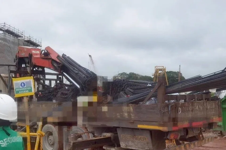 Man arrested after worker dies unloading steel bars at Tengah executive ...