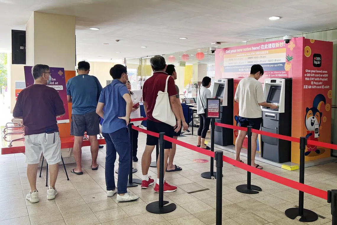 Tradition comes first as many brave long queues at some pop-up ATMs for ...