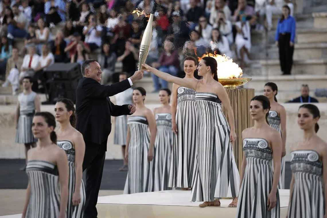 Paris organisers receive flame in Athens ahead of relay | The Straits Times