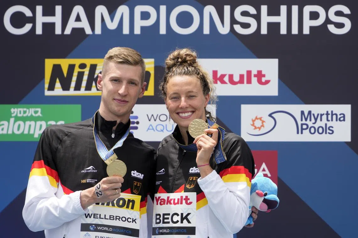 Germany’s Wellbrock, Beck complete golden open water double at swimming ...