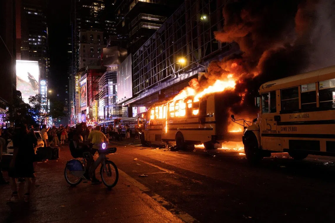 World Cup bus set alight as chaotic celebrations erupt in Manhattan ...