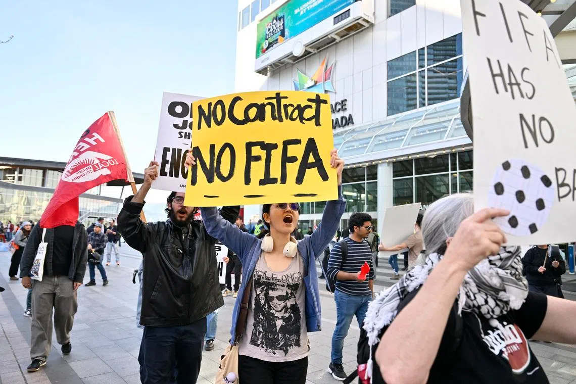Advocates for homeless, hotel workers rally outside FIFA Congress in ...