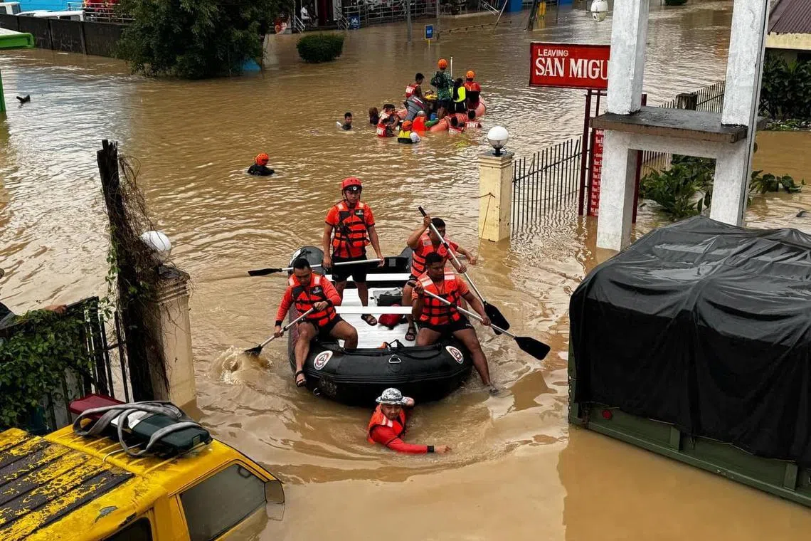 Philippine rescuers battle flood waters to reach stranded residents ...