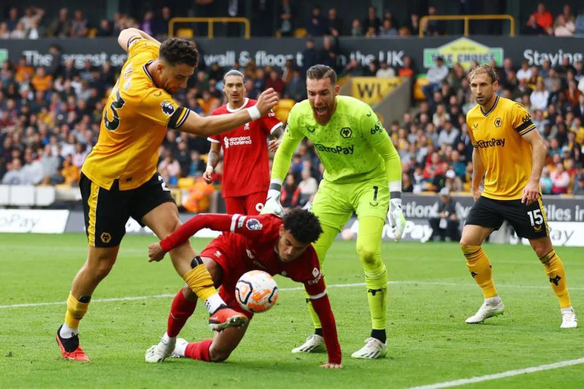 Liverpool go top of the English Premier League with 3-1 win at Wolves ...