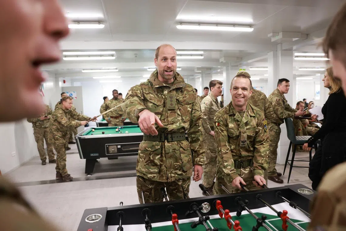 Prince William wears battle gear on visit to British troops in Estonia ...