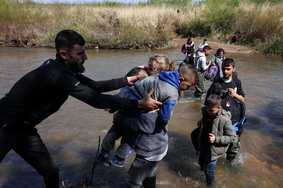 Syrians flee sectarian killing into Lebanon | The Straits Times