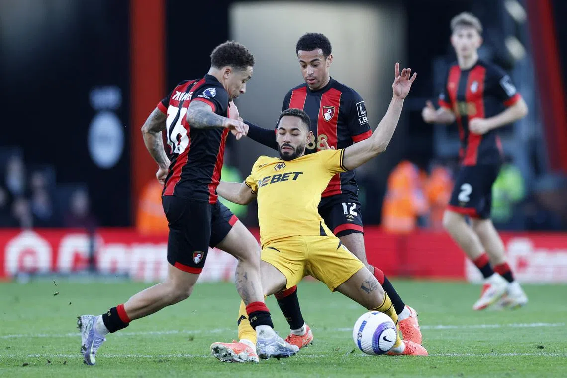 Wolves win at 10-man Bournemouth to pull away from relegation zone ...